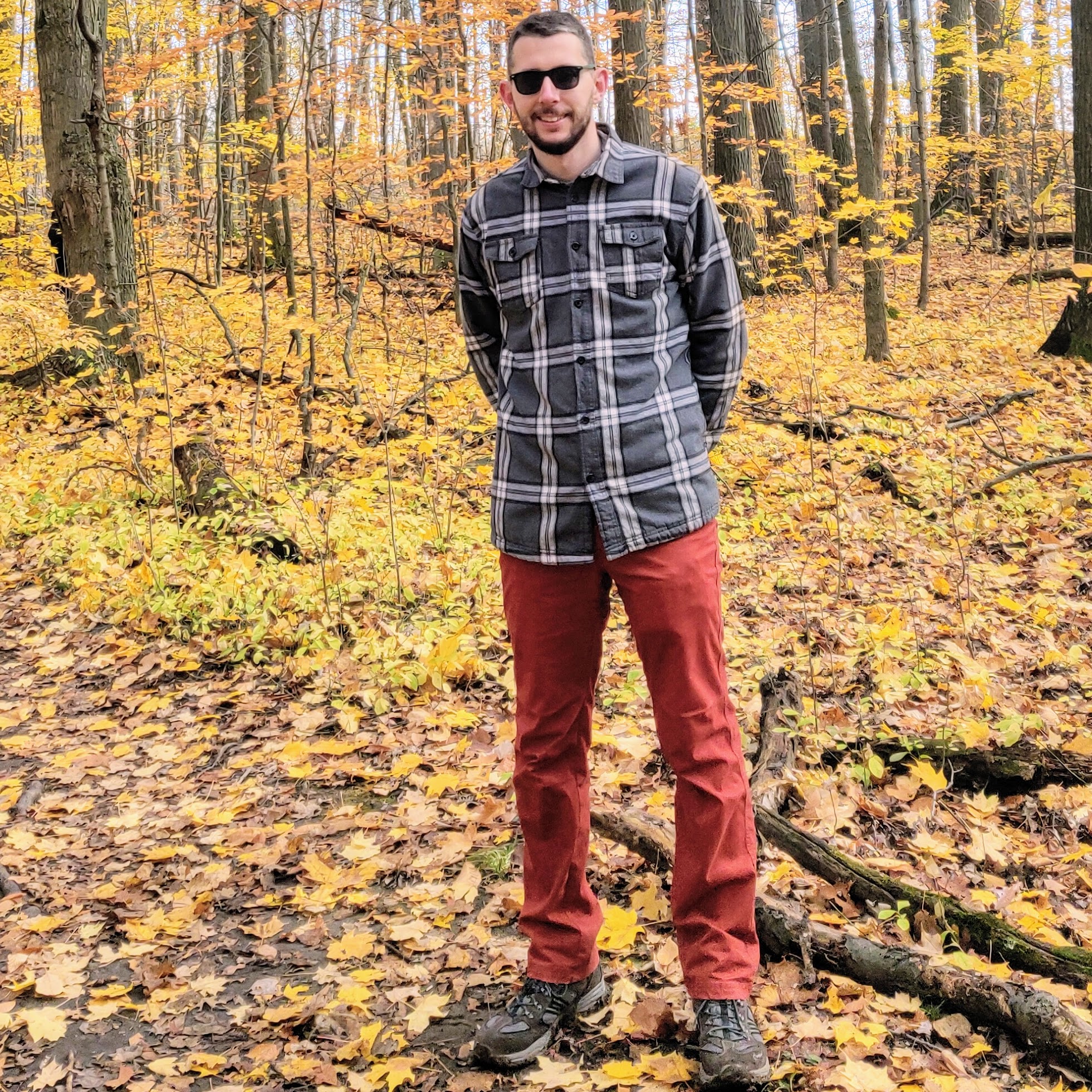 Photo of Matt Cotton in the woods during fall/autumn.